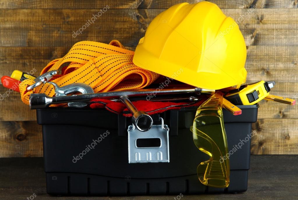 Black toolbox with tools on wooden background — Stock Photo ...