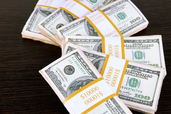Stacks of money on wooden table — Stock Photo © belchonock #33314475