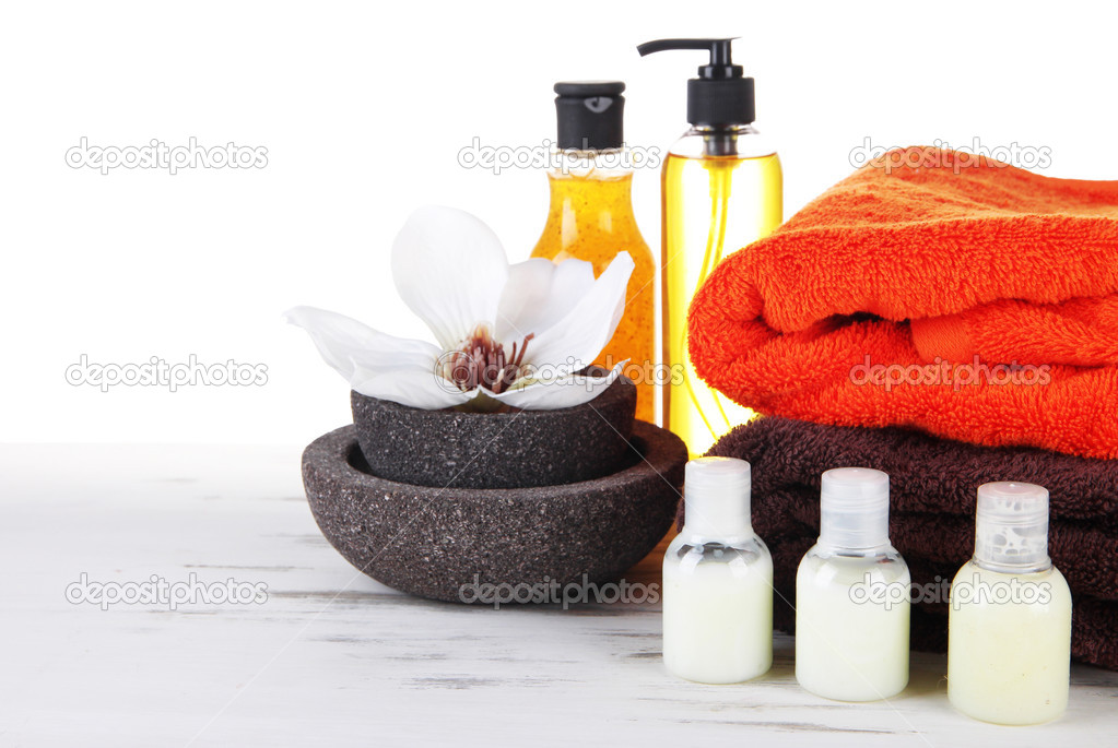 Beautiful spa setting with flower on wooden table on white background ...