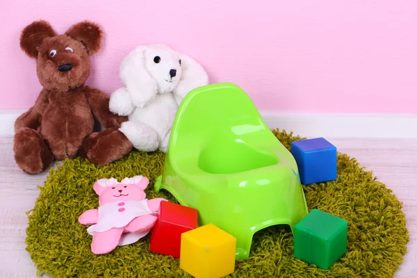Green potty on home interior background — Stock Photo © belchonock ...