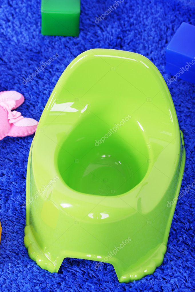 Green potty on home interior background — Stock Photo © belchonock ...