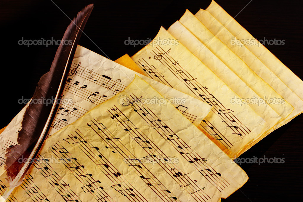 Musical notes and feather — Stock Photo © belchonock #39908389