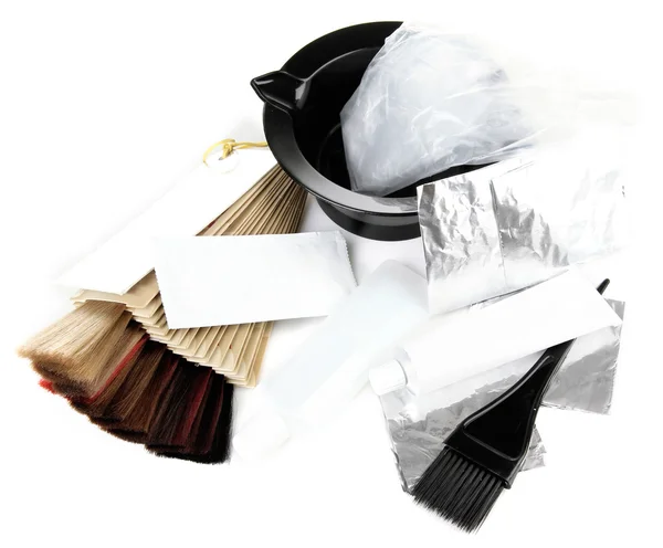 Hair dye kit and hair samples of different colors, on wooden background ...