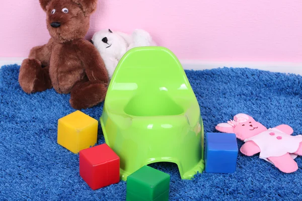 Green potty on home interior background — Stock Photo © belchonock ...