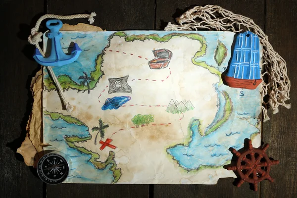 Treasure map with sea accessories, on wooden background Stock Photo by ...