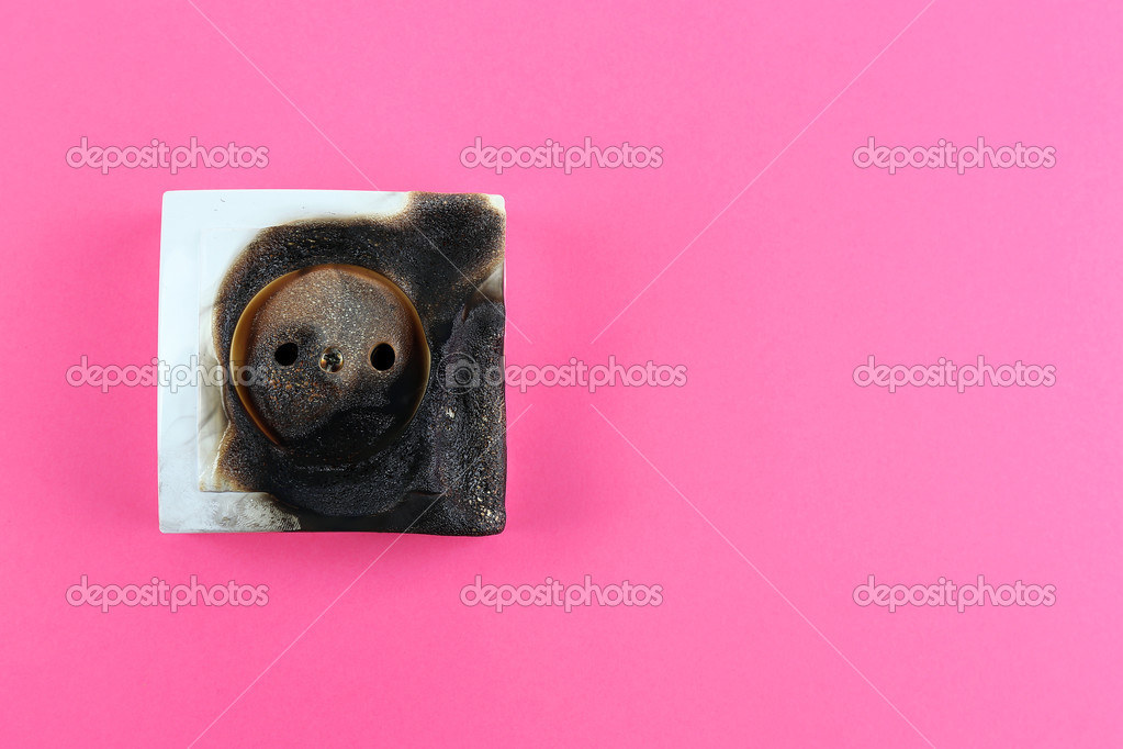 Burned plug socket close up Stock Photo by ©belchonock 40395071