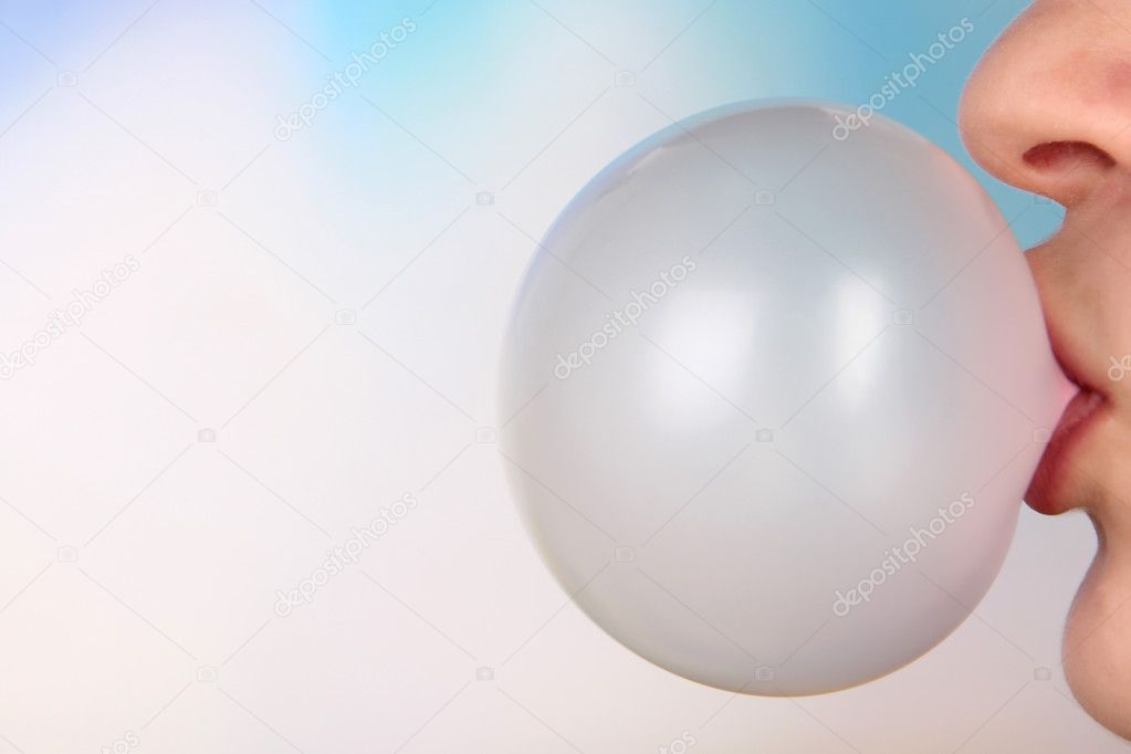 Person doing bubble with chewing gum on bright background Stock Photo ...