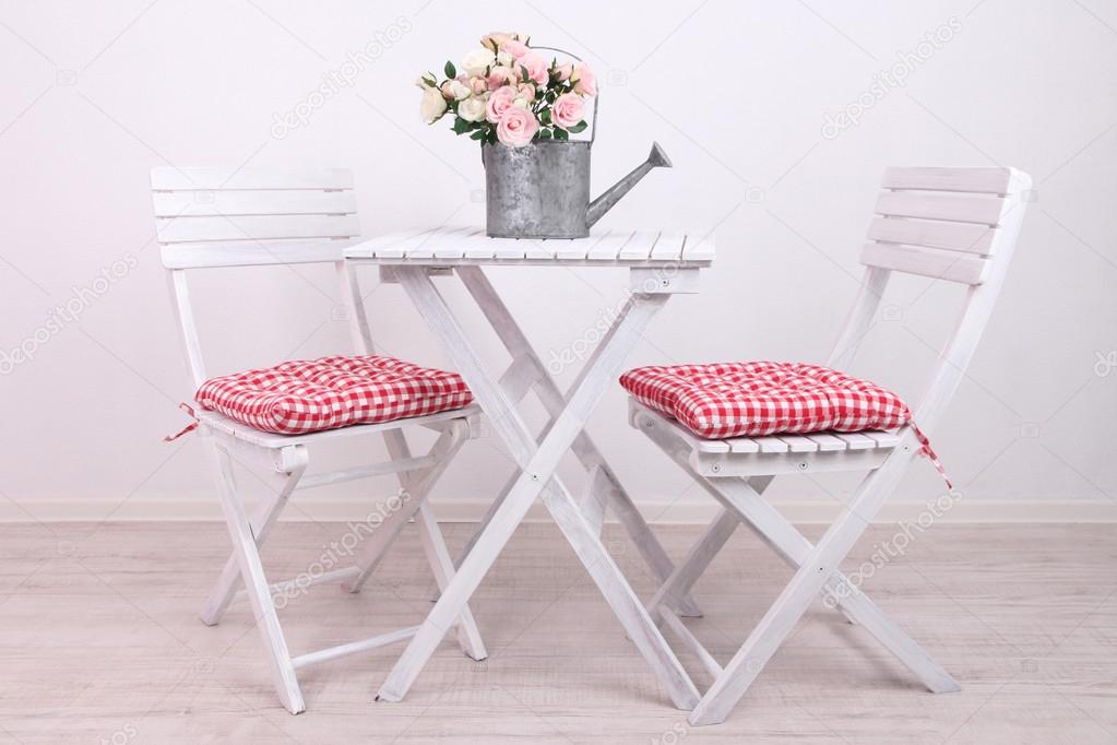 Garden chairs and table with flowers on white background Stock Photo by ...
