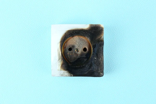 Burned plug socket close up Stock Photo by ©belchonock 40395071