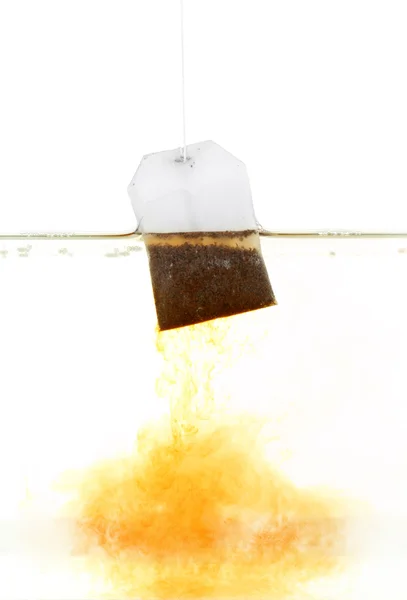 Tea bag dipped in hot water Stock Photo by ©belchonock 42473877