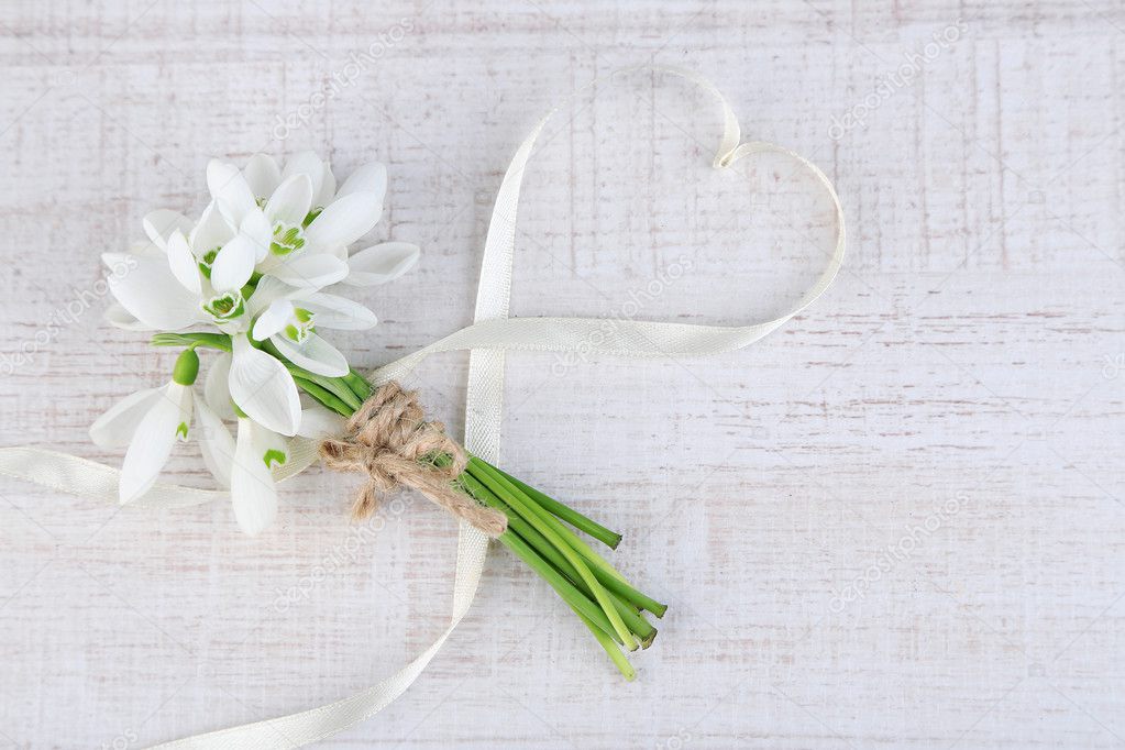 Bouquet of beautiful snowdrops on wooden background Stock Photo by ...
