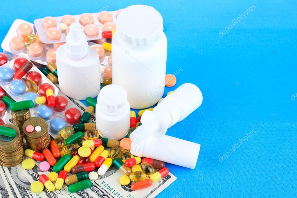 Prescription drugs on money background representing rising health care ...