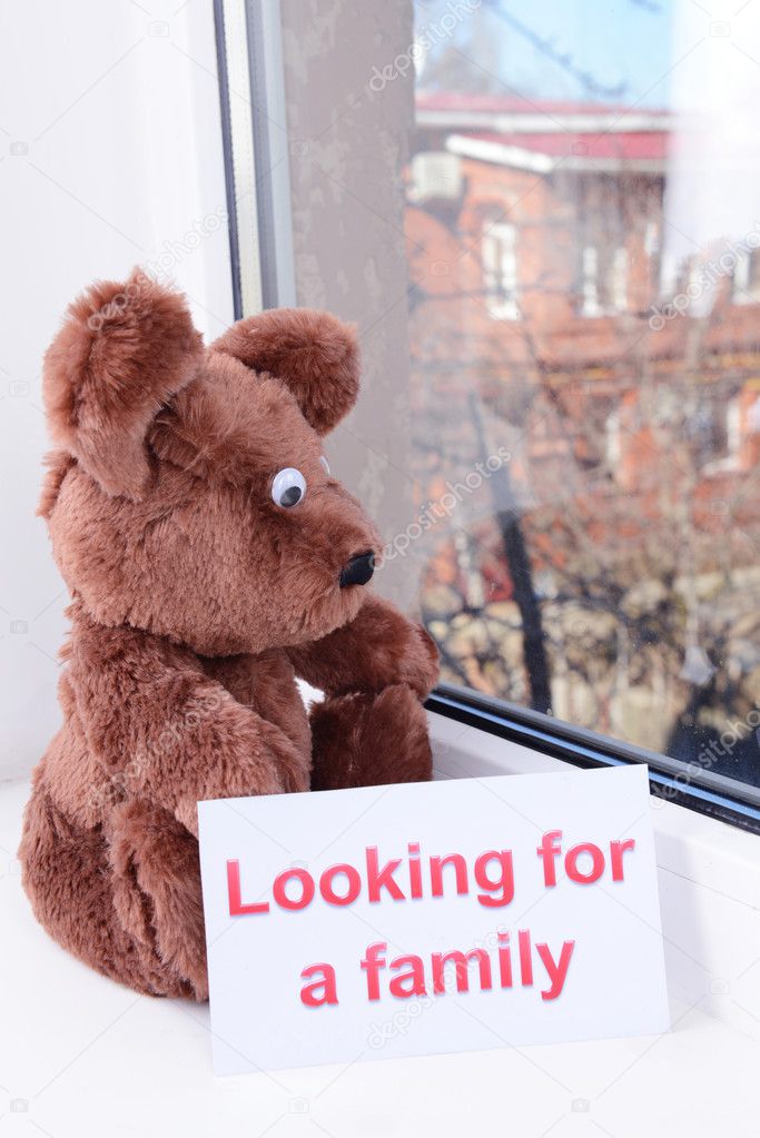 Toy-bear looking out window close-up Stock Photo by ©belchonock 43220759