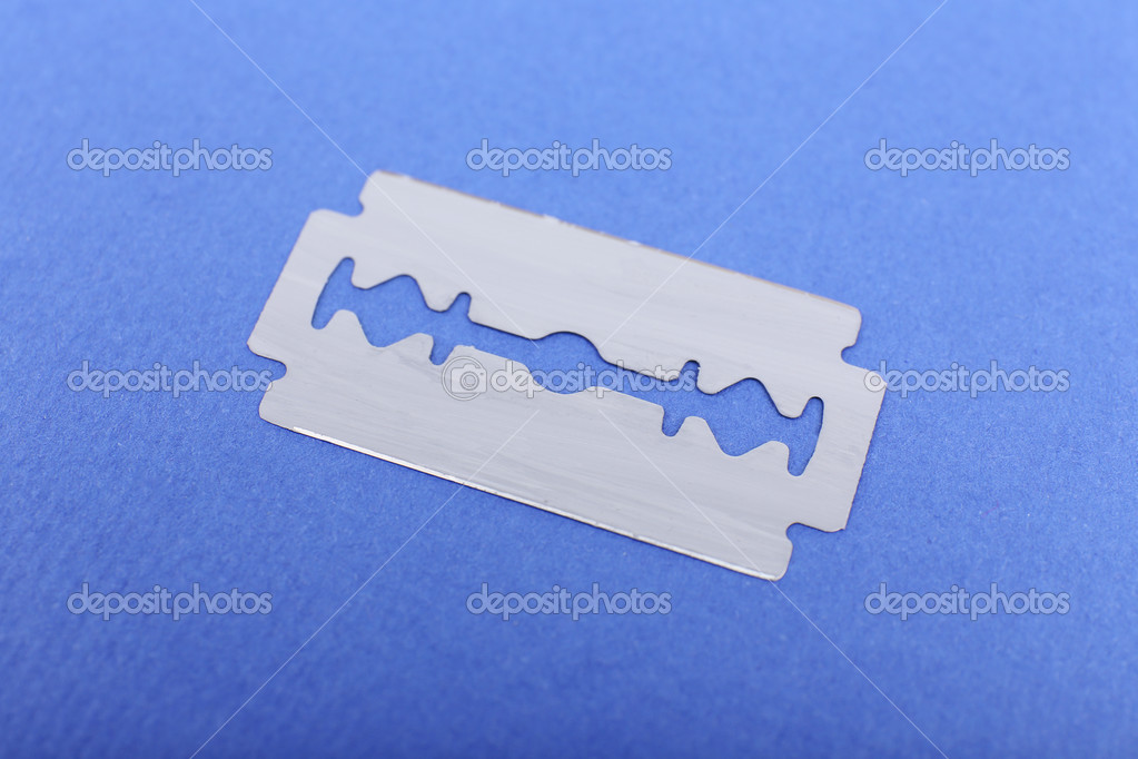 Razor blade on color background — Stock Photo © belchonock #43725881