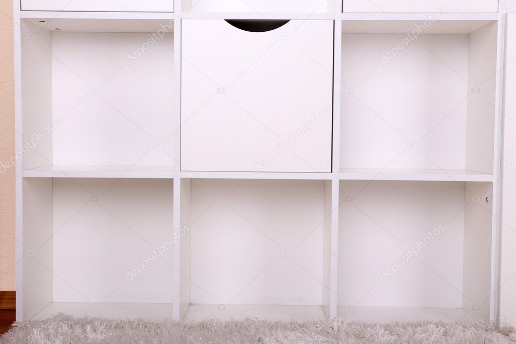 Empty white shelves close up — Stock Photo © belchonock #43874239