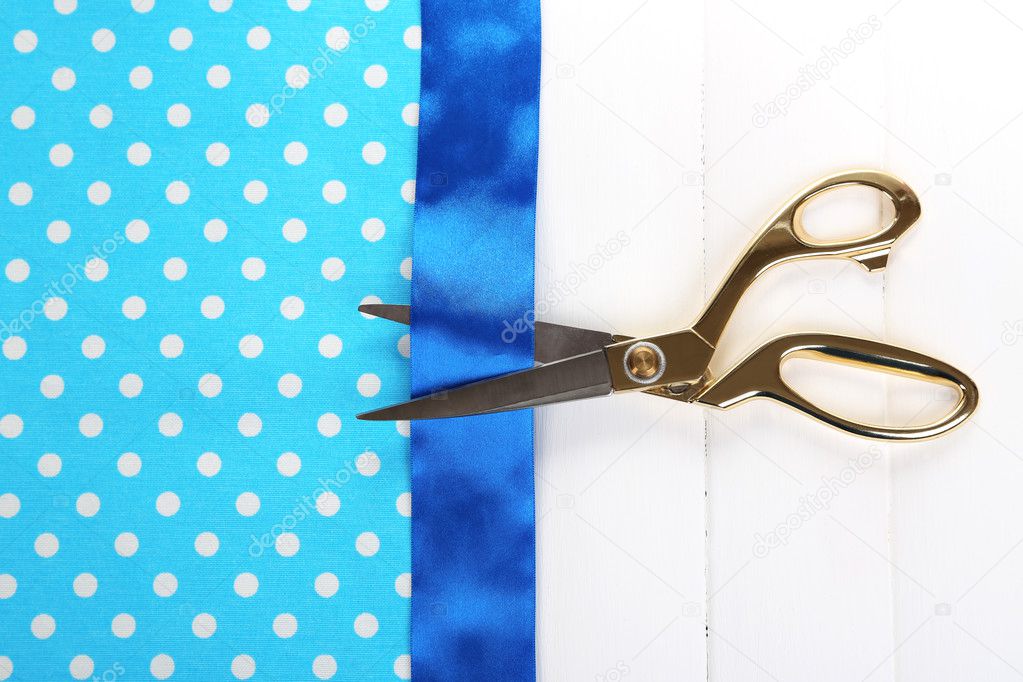 Scissors on color fabric background Stock Photo by ©belchonock 44966817