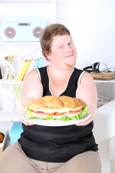 Fat man eating sandwich Stock Photo by ©belchonock 46203785