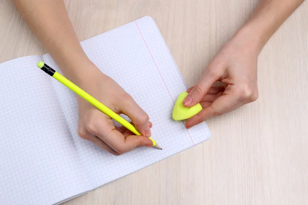 Hand with color pencils and paper Stock Photo by ©belchonock 86376030