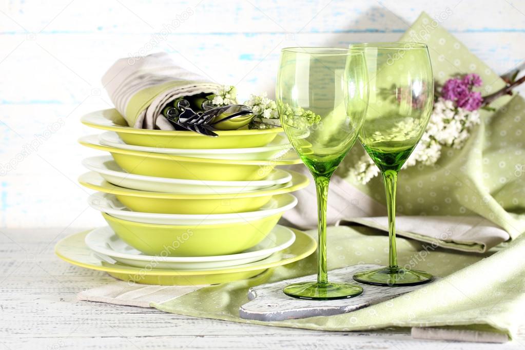 Green table settings, on table, on light background — Stock Photo ...