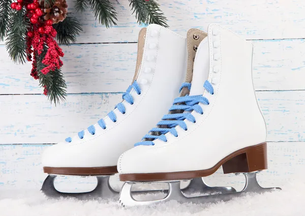Figure skates on wooden background - Stock Image - Everypixel