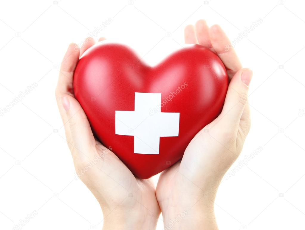 Red heart with cross sign in female hands — Stock Photo © belchonock ...