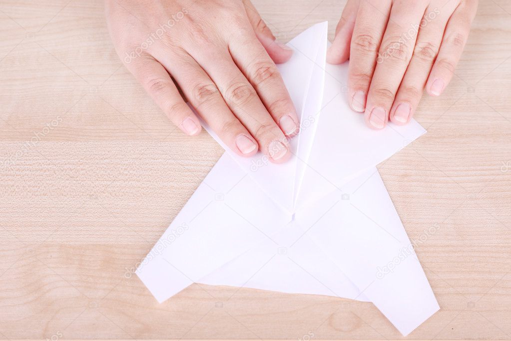 Hands making origami figure, close up Stock Photo by ©belchonock 49775051