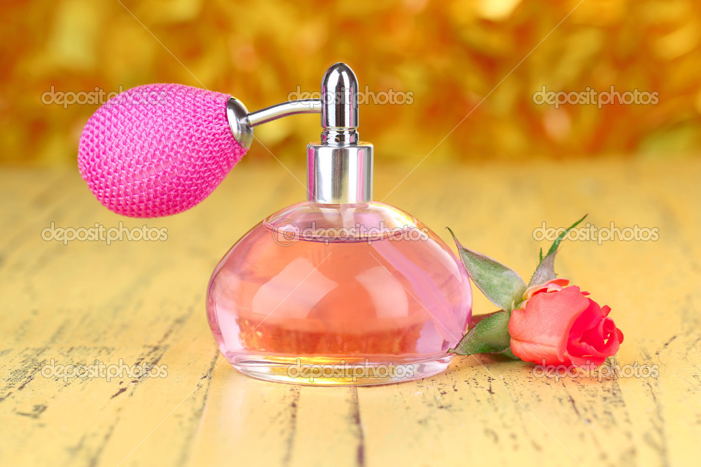 Perfume bottle with rose — Stock Photo © belchonock #50325821