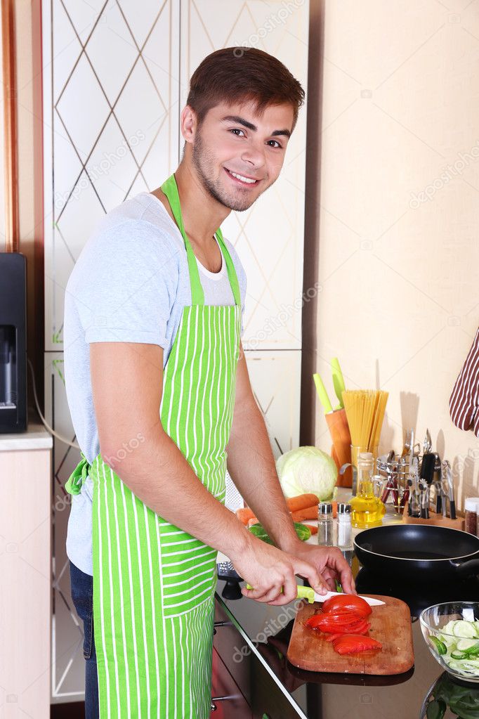 Man cooking in kitchen — Stock Photo © belchonock #50326553