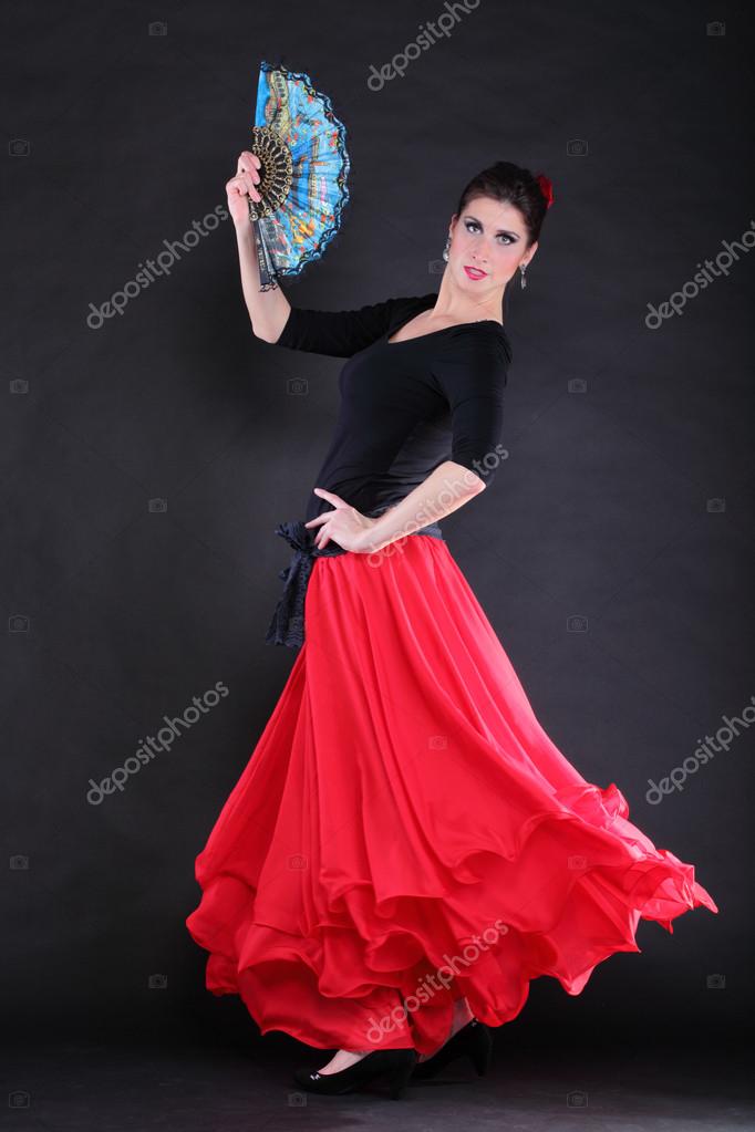 Attractive spanish young woman dancing flamenco over black backg Stock ...