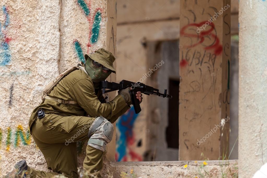 Armed man with a gun Stock Photo by ©JamaL1977a 46260369