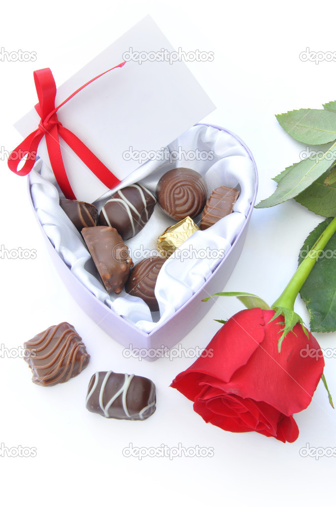 Chocolates and red rose Stock Photo by ©nupix 19484101