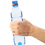 Human hand holding a bottle of water — Stock Photo © nejron #1741161