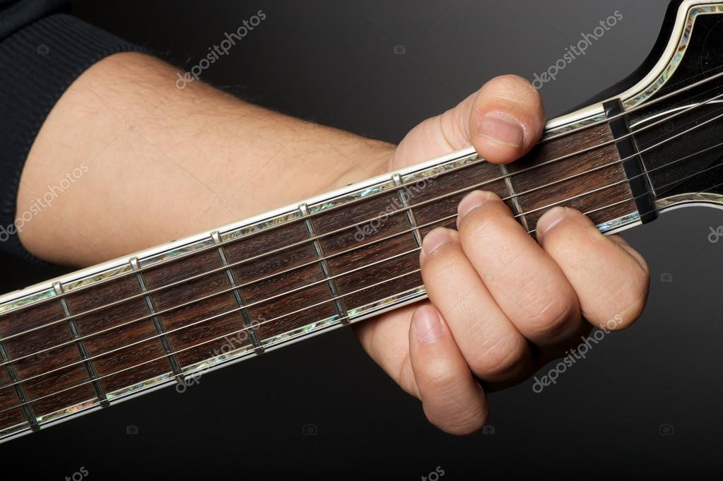Minor guitar chords Stock Photo by ©ferrerivideo 41047227
