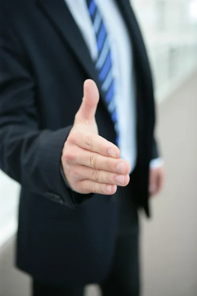 Man reaching out to shake hands - Stock Image - Everypixel