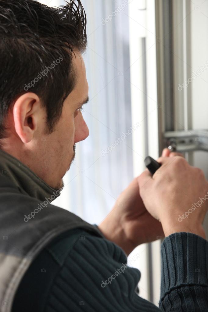 Man fitting a window Stock Photo by ©photography33 14033414