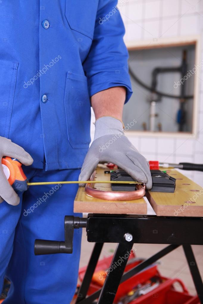 Plumber measuring copper pipe Stock Photo by ©photography33 14271167