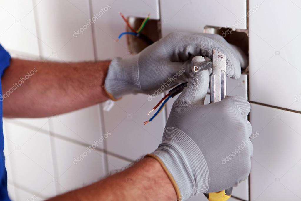 Electrician cutting a cable — Stock Photo © photography33 #14561477