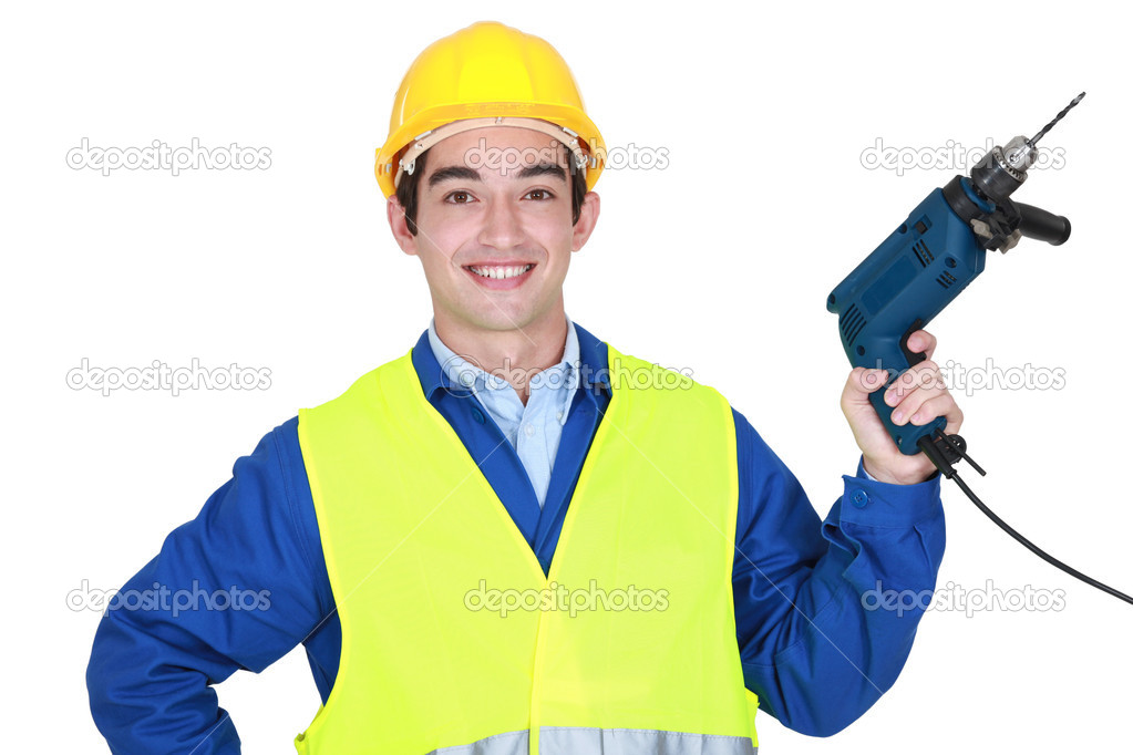 Construction worker holding a power tool — Stock Photo © photography33 ...