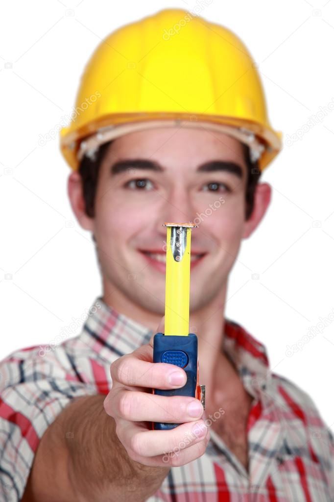 A handyman handing a meter. — Stock Photo © photography33 #14911501