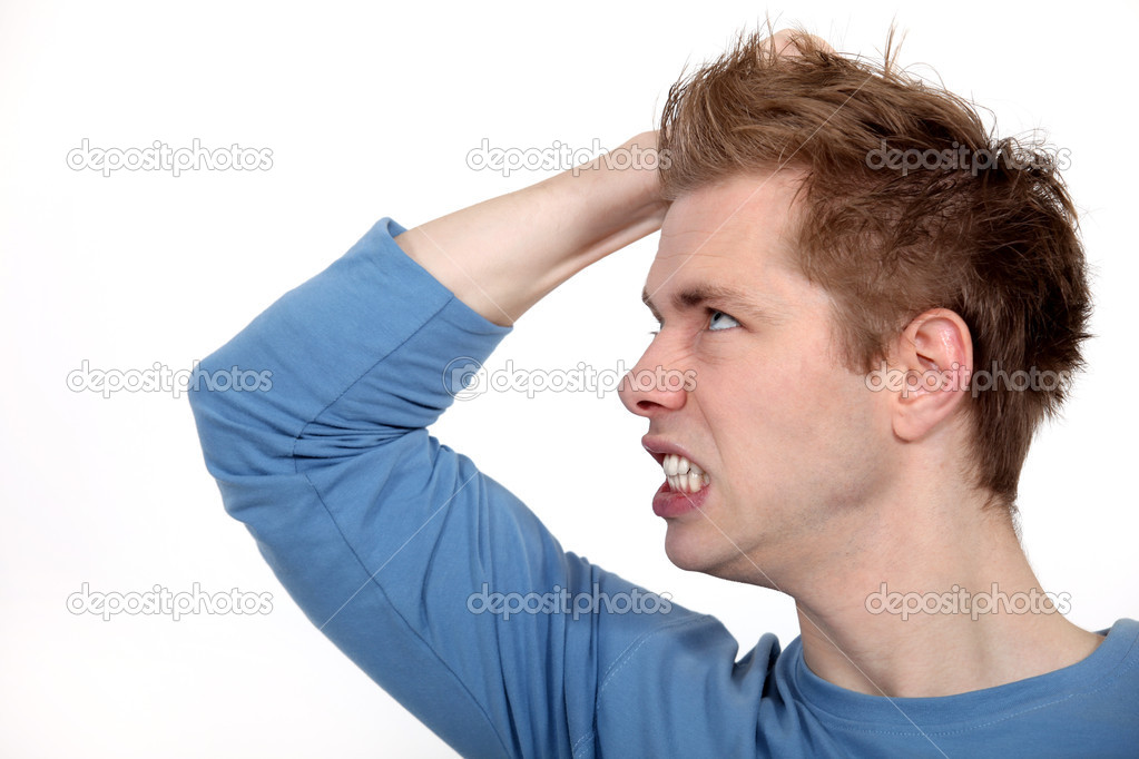 An angry man baring his teeth — Stock Photo © photography33 #16600619