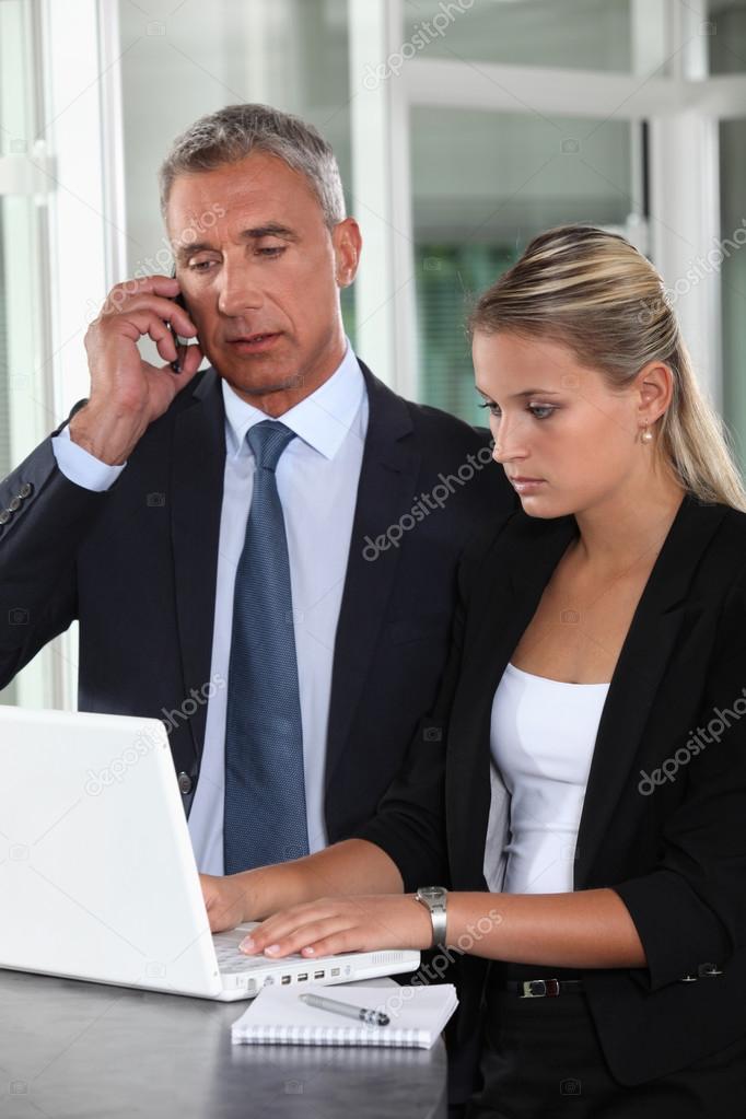 Boss and personal assistant preparing for meeting Stock Photo by ...