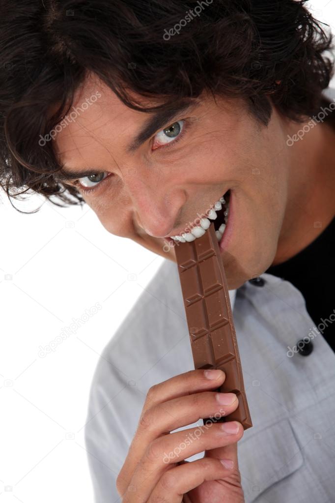 Man eating chocolate Stock Photo by ©photography33 16781743