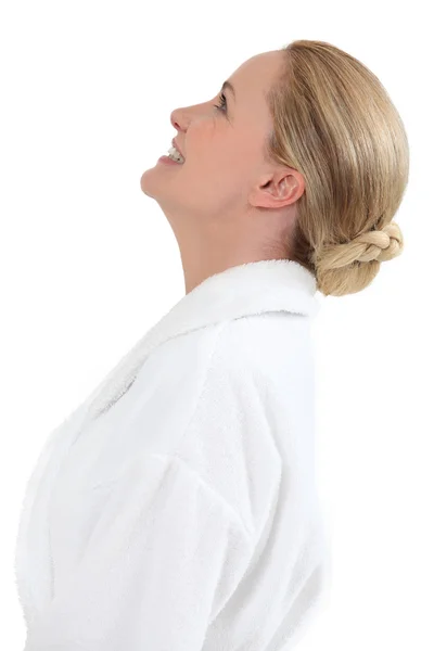 Woman taking off her robe — Stock Photo © photography33 #10093159