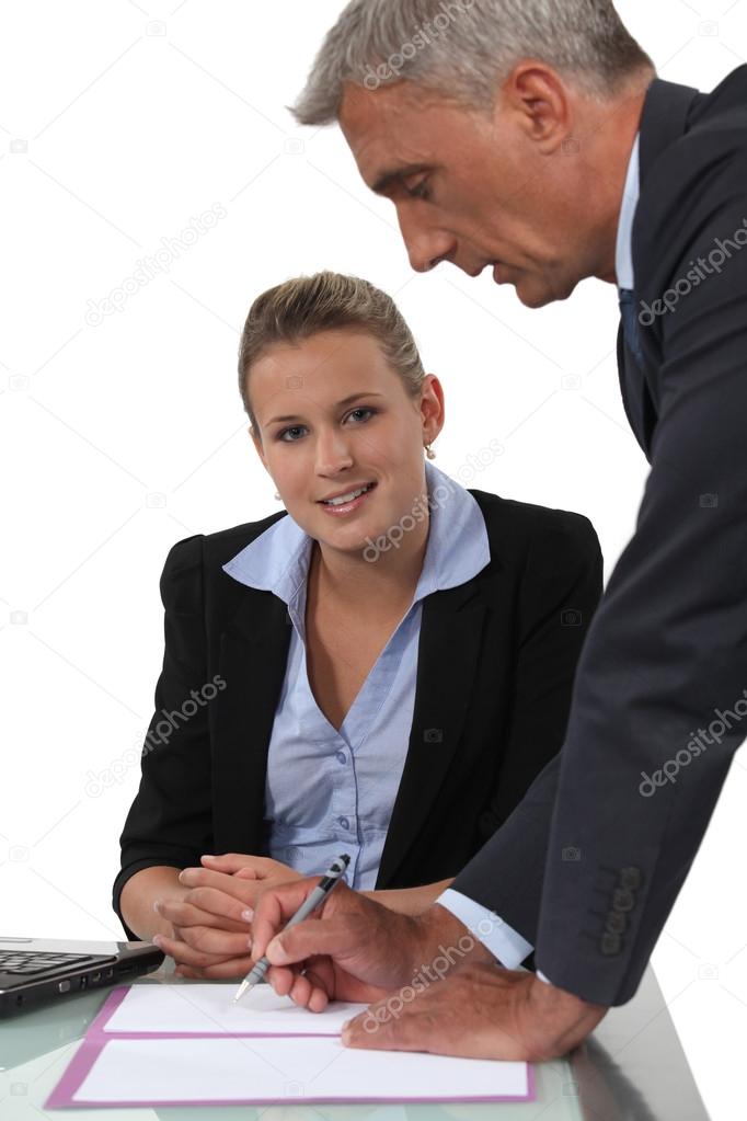 Boss signing document for secretary — Stock Photo © photography33 #17122447