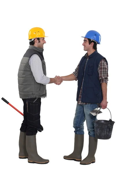 Construction workers handshaking ⬇ Stock Photo, Image by ...