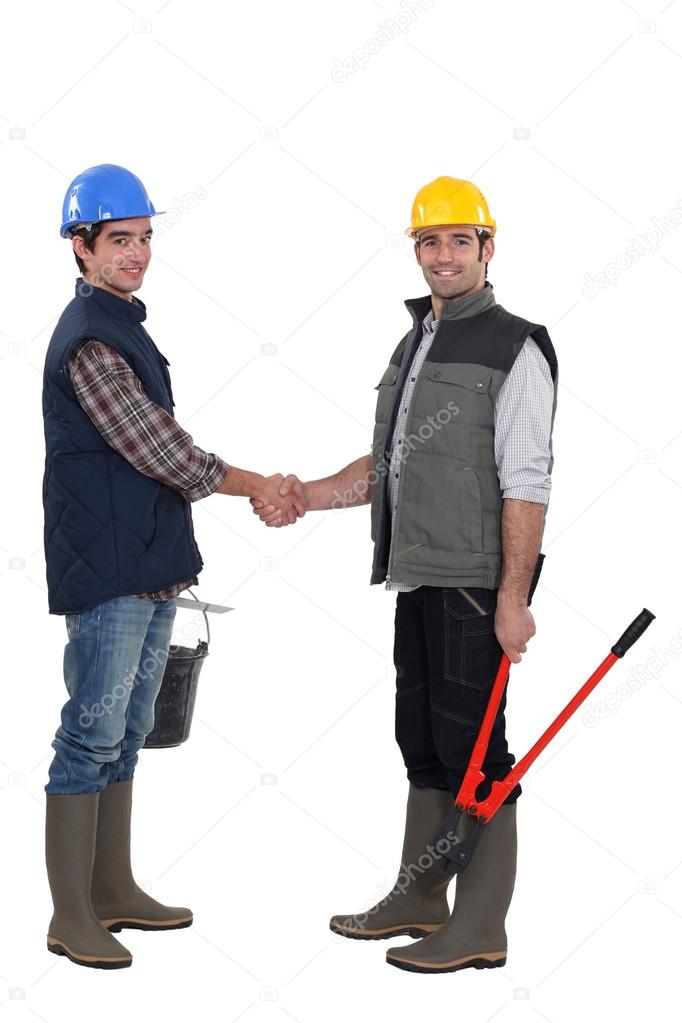 Construction workers handshaking ⬇ Stock Photo, Image by ...