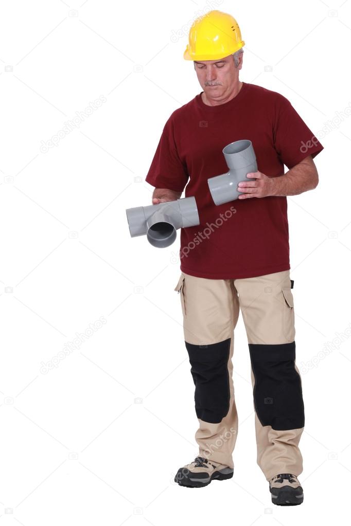 Plumber fitting two plastic pipes together — Stock Photo ...