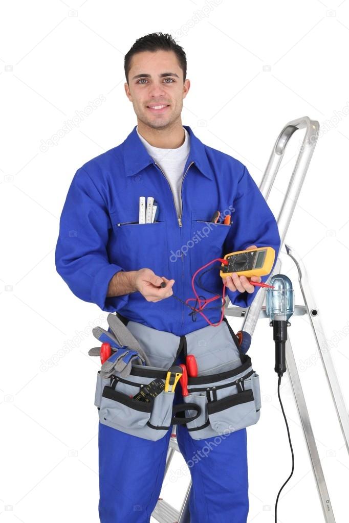 Handyman holding a multimeter — Stock Photo © photography33 #17624651