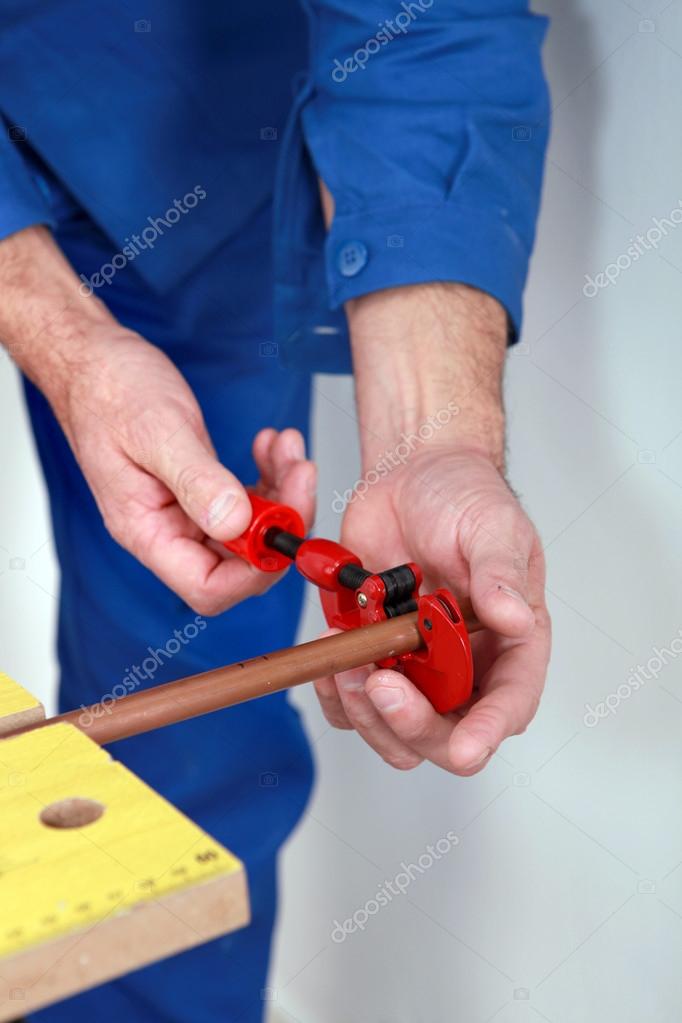 Plumber with a pipe cutter Stock Photo by ©photography33 18428257