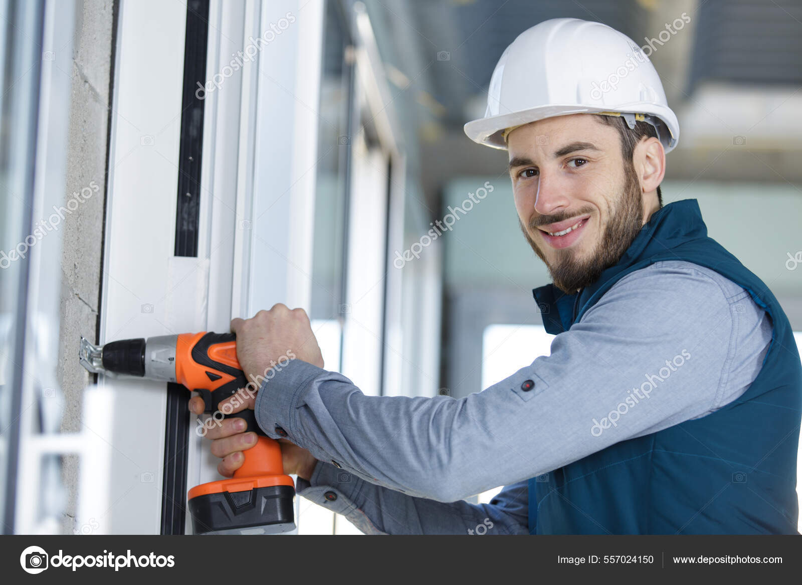 Portrait Male Builder Using Cordless Drill Stock Photo by ...